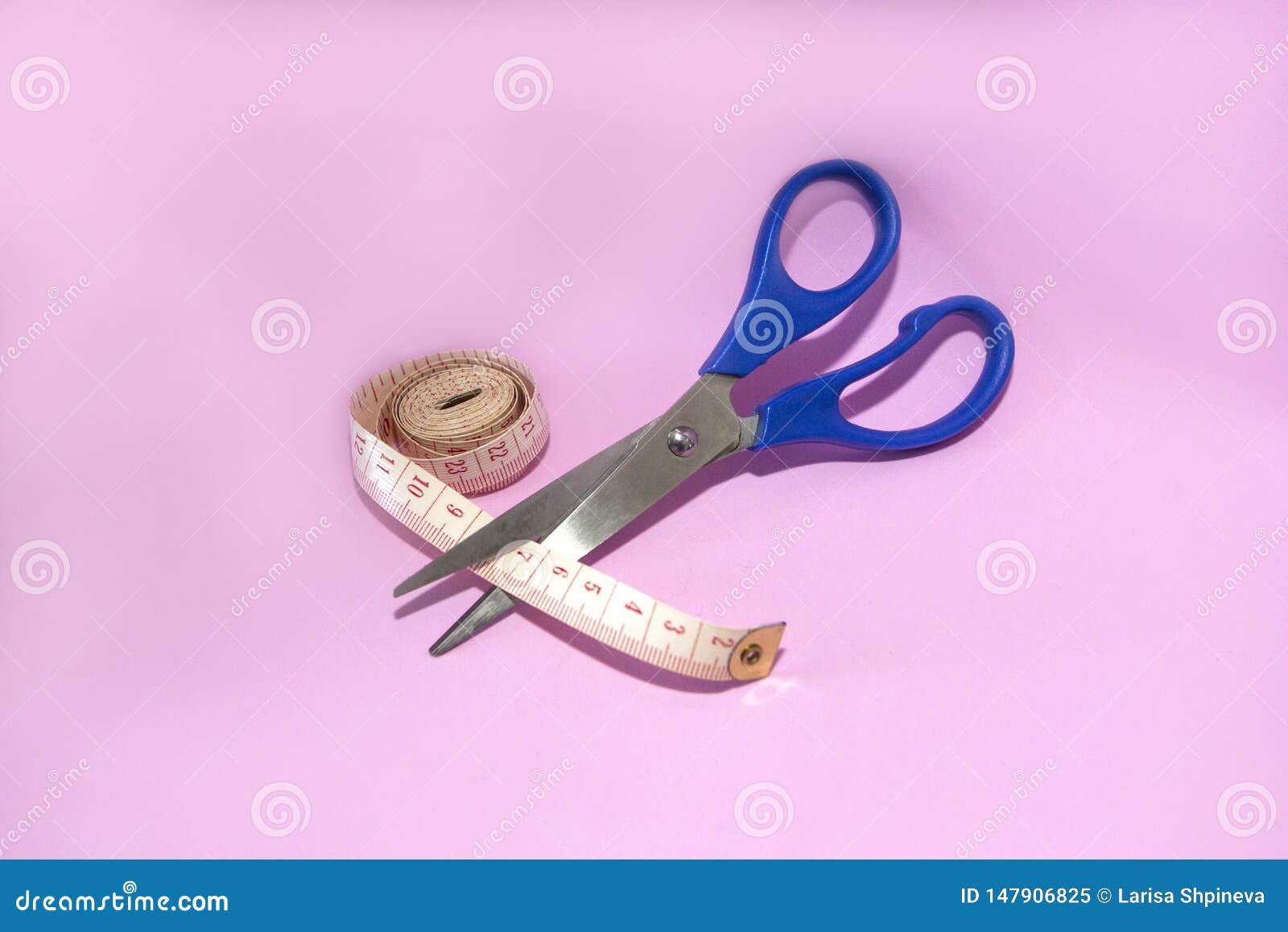 Scissors Cutting Tape Measure Isolated on Pink Background Stock Image ...