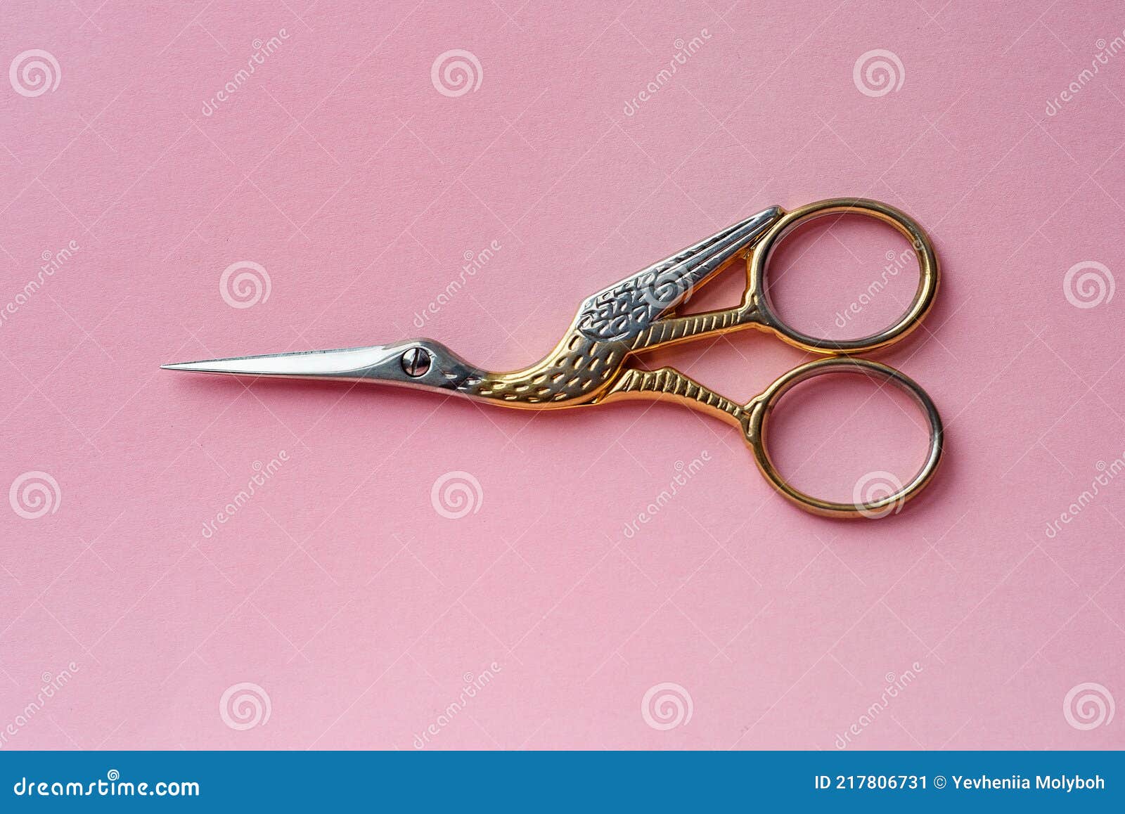 Scissors In The Form Of A Bird Made Of Gold And Silver On A Pink ...