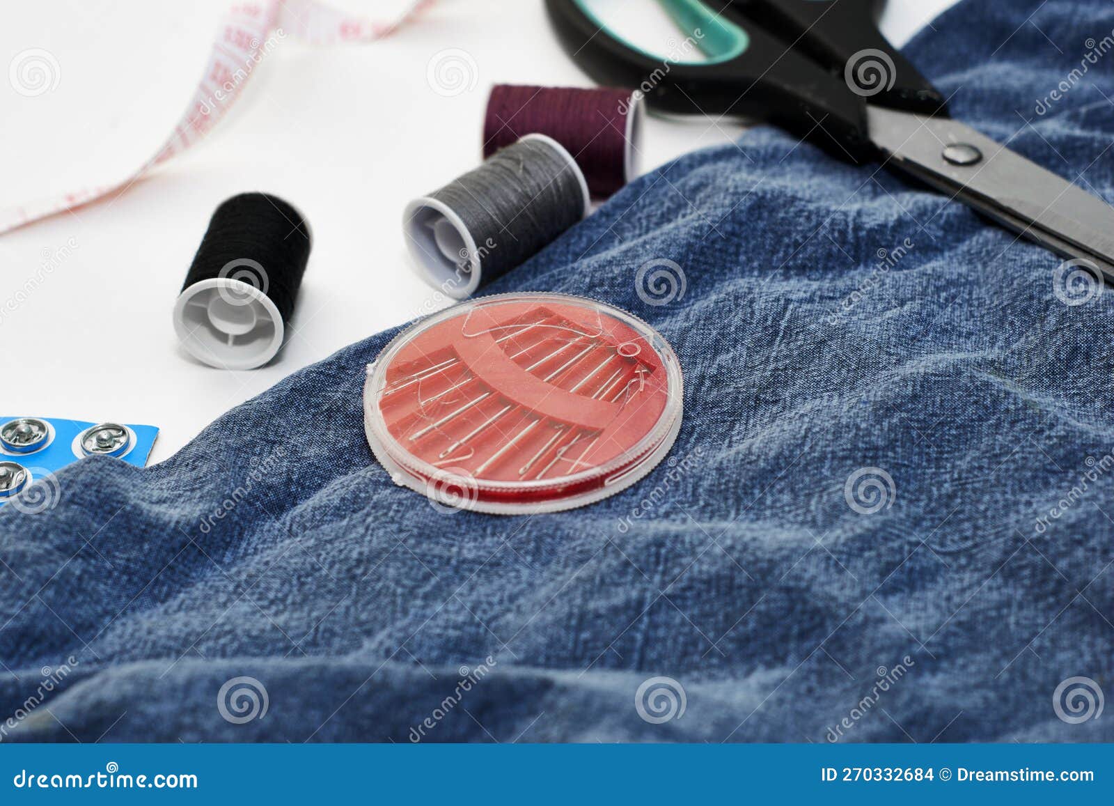 Scissors Needles Measuring Tape and Thread on the Background of Torn ...