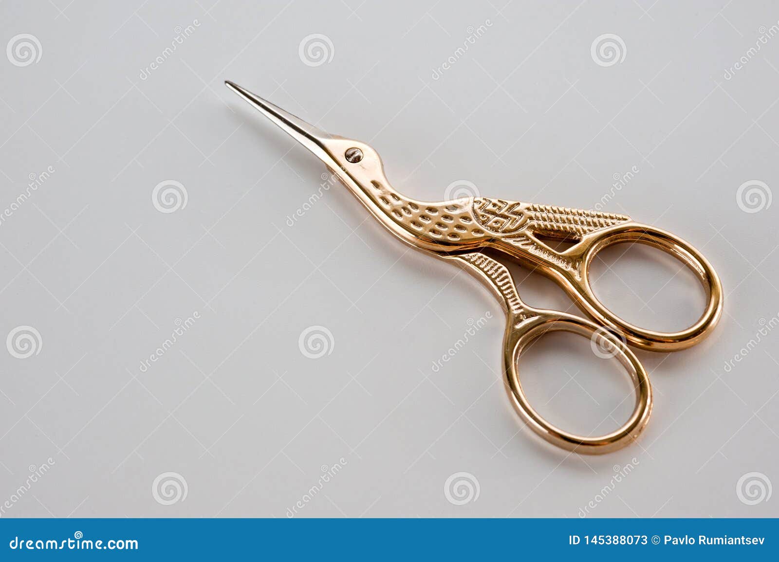 Scissors In The Form Of A Bird Made Of Gold And Silver On A Pink ...