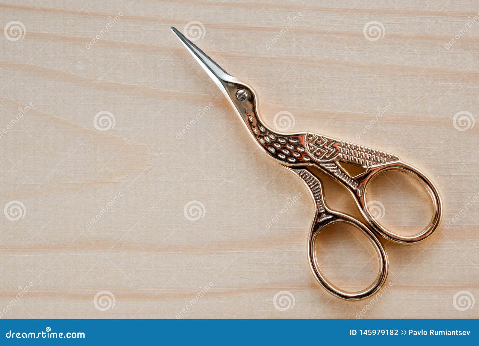 Scissors In The Form Of A Bird Made Of Gold And Silver On A Pink ...