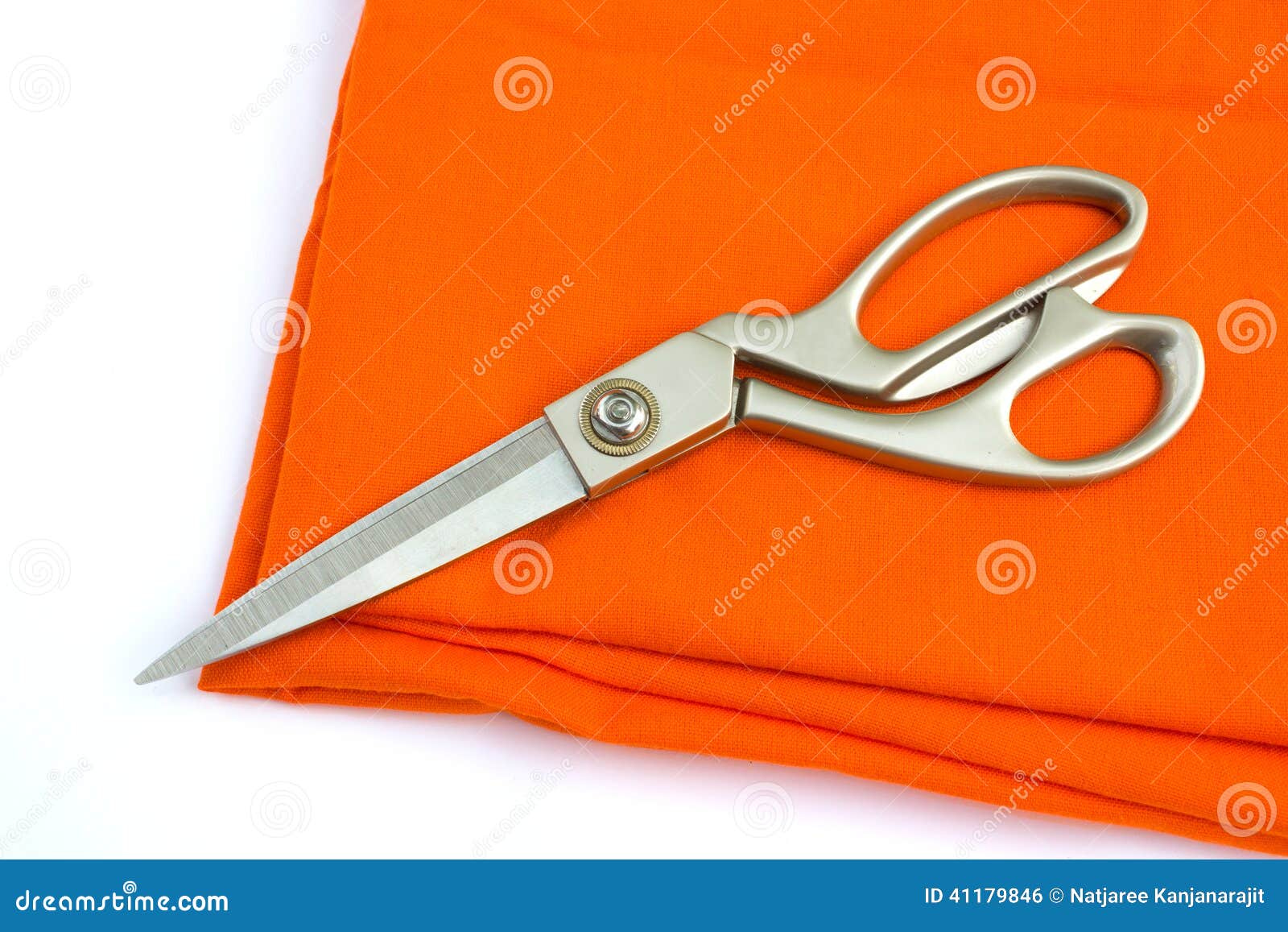 Scissors on orange cloth stock photo. Image of pattern - 41179846