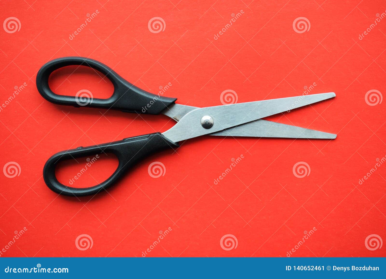 Stationery Scissors with Plastic Handles on a Red Background Stock ...