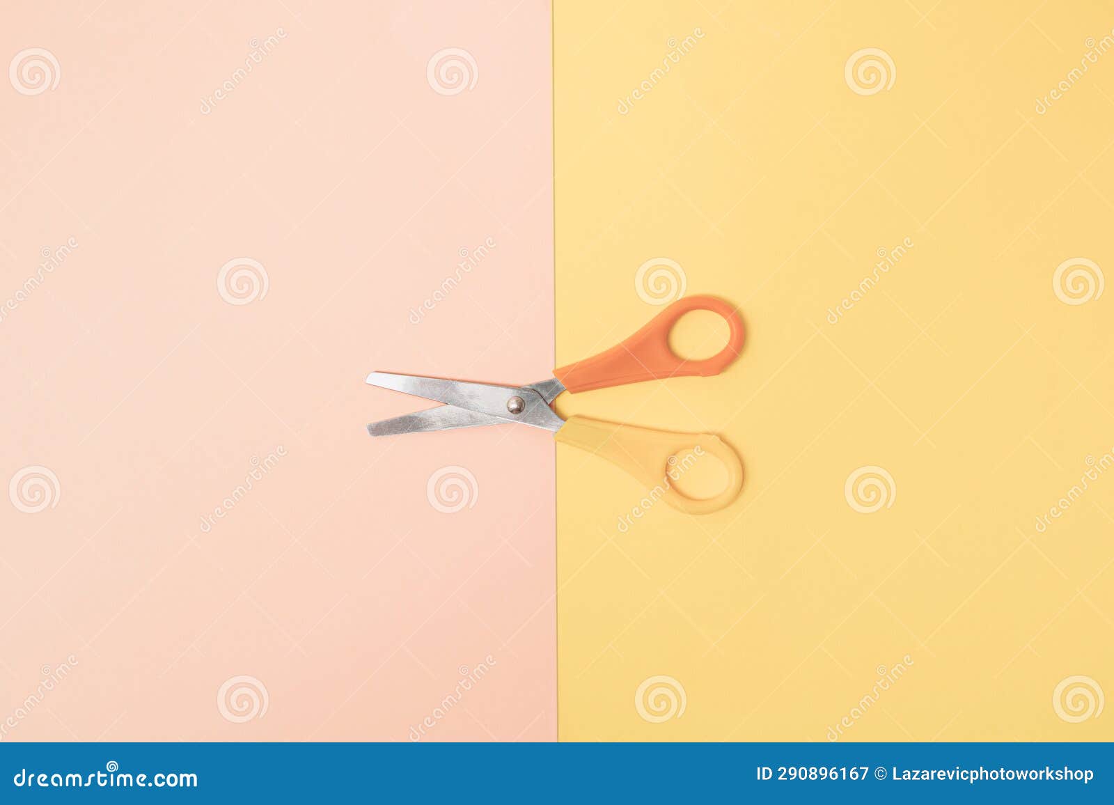 Scissors with Yellow and Orange Handle on Pastel Pink and Yellow ...