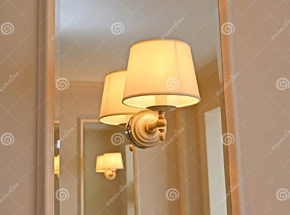 The Sconce is Mounted on a Mirror Panel Stock Photo - Image of mirror ...