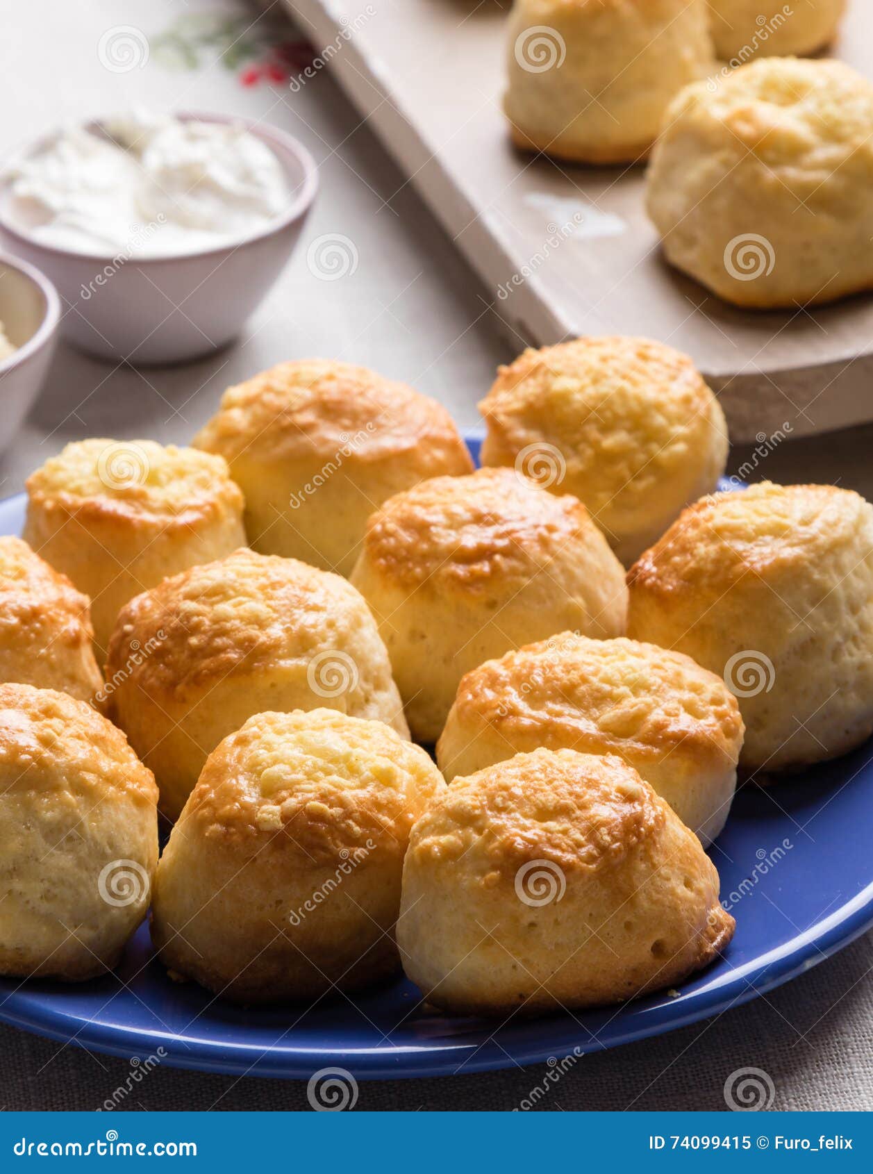Scones on blue plate stock image. Image of rustic, scone - 74099415