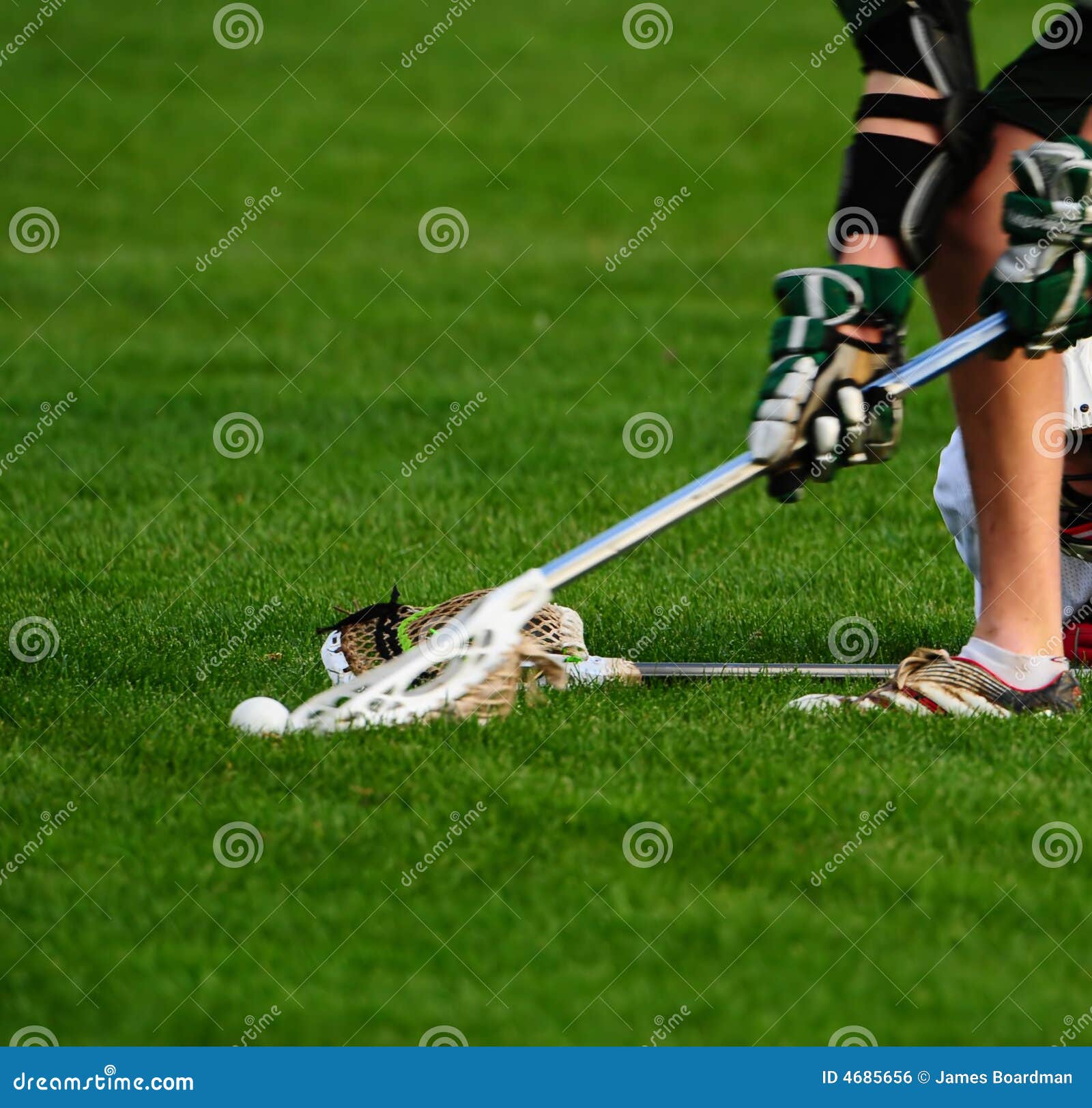 Scooping up the ball stock photo. Image of game, grass - 4685656