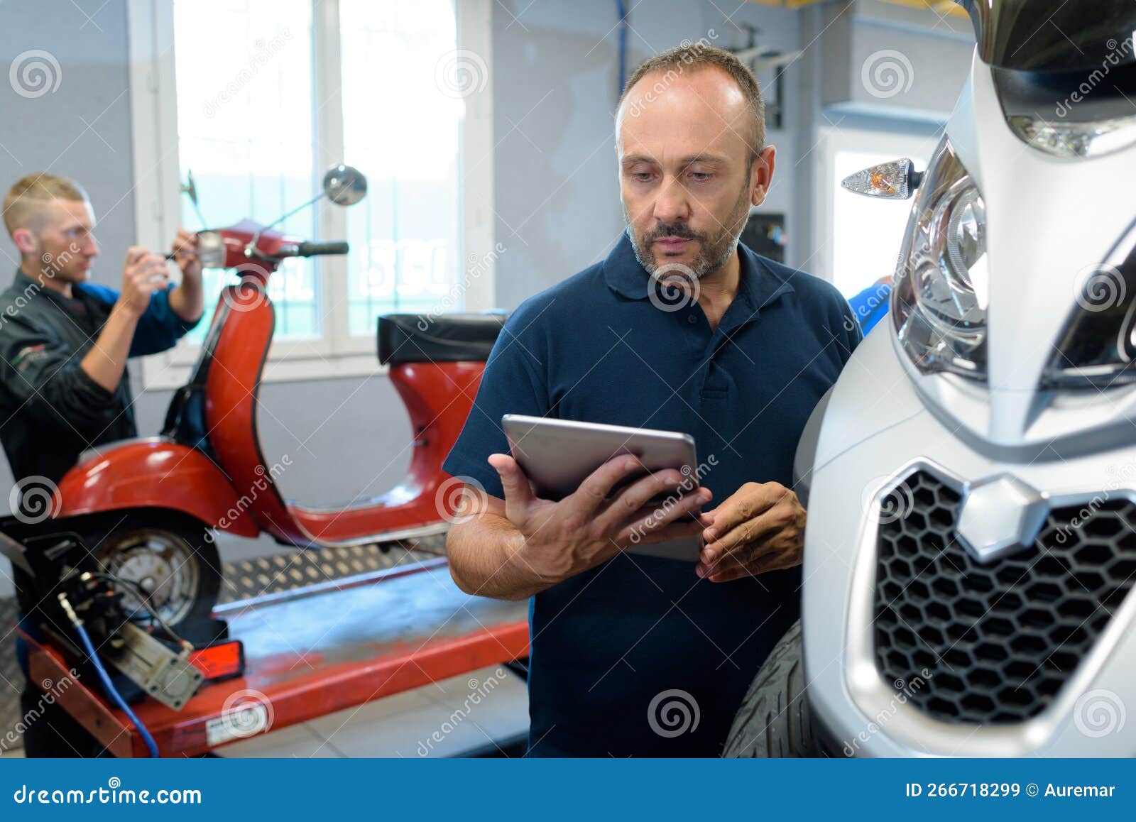 Scooter Senior Mechanic Checking Details Stock Image - Image of drift ...