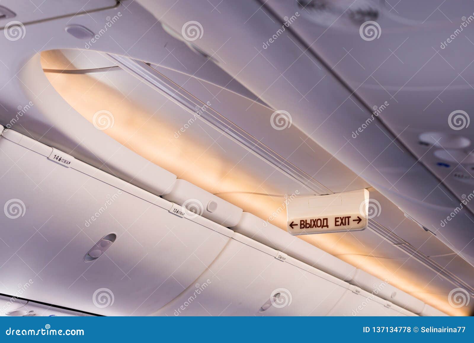 Exit Sign Aboard Modern Jet Aircraft Stock Photo - Image of aircraft ...