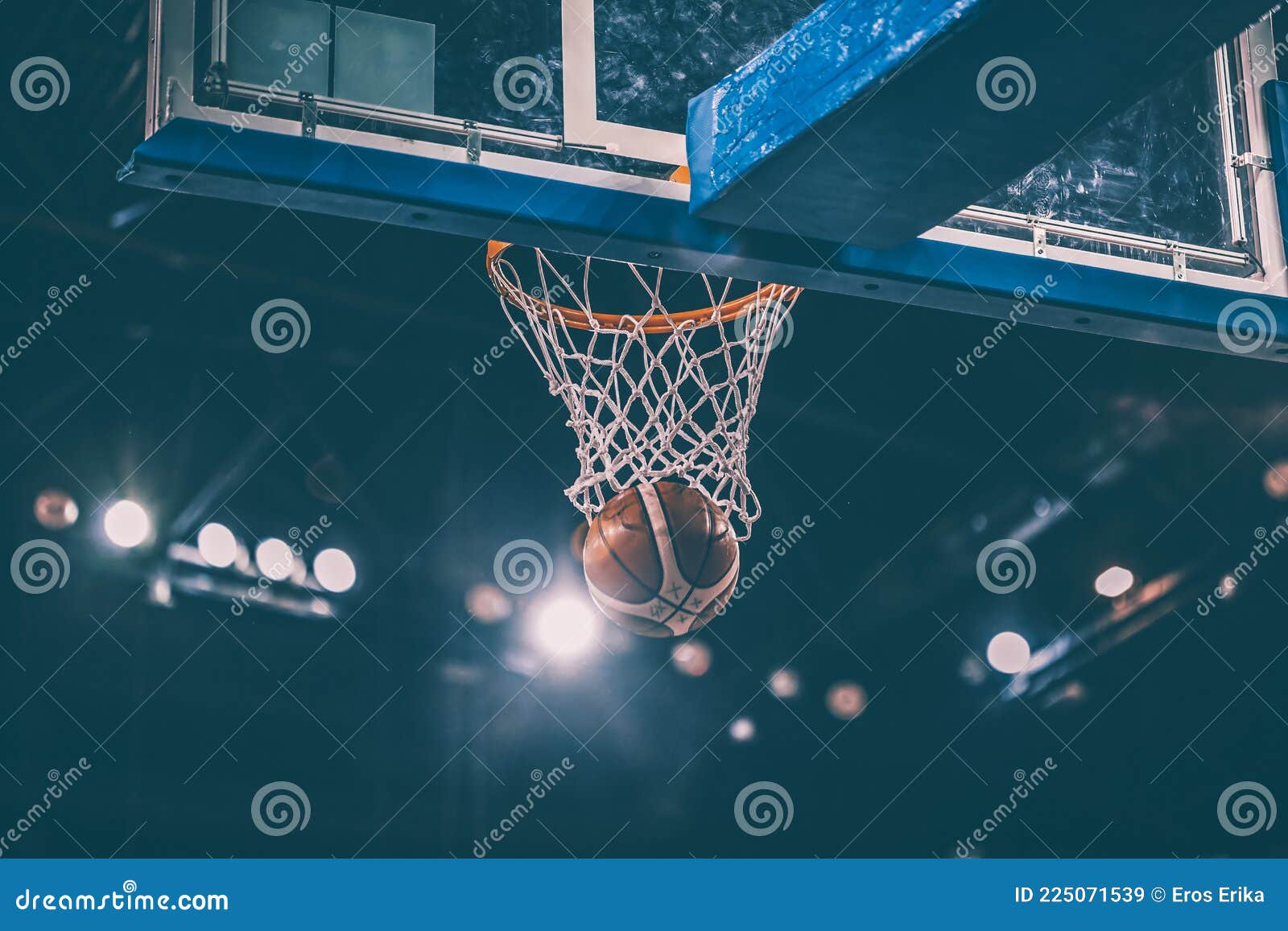 Scoring during a Basketball Game Ball in Hoop Stock Image - Image of ...