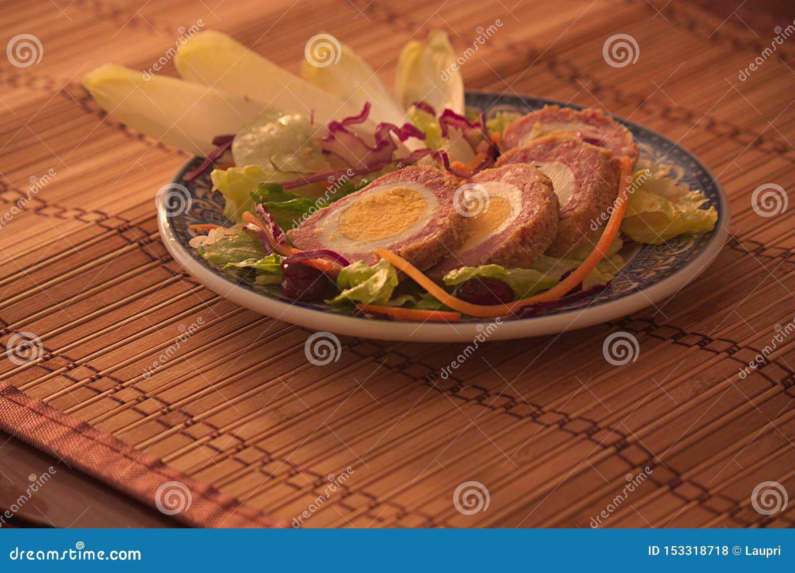 Scottish Eggs Served with a Vegetable Garnish Stock Photo - Image of ...