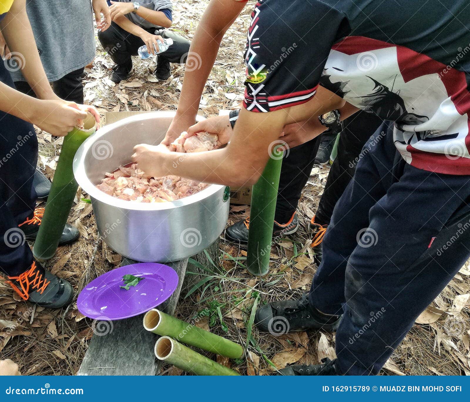 Scout Boys Preparing Chicken Inside Bamboo are Grilled with Flame for ...