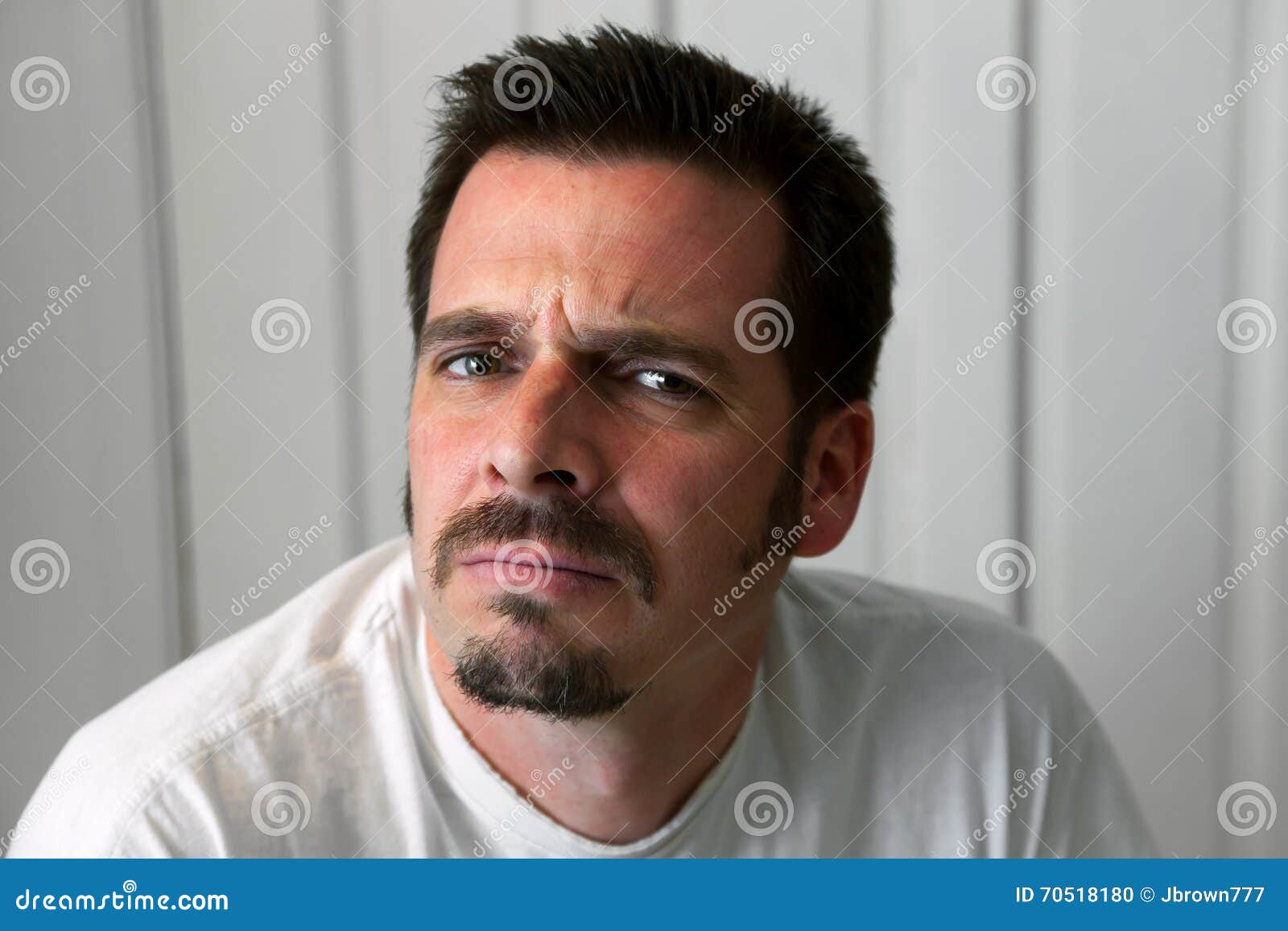 Scowling Man with Goatee stock photo. Image of frowning - 70518180