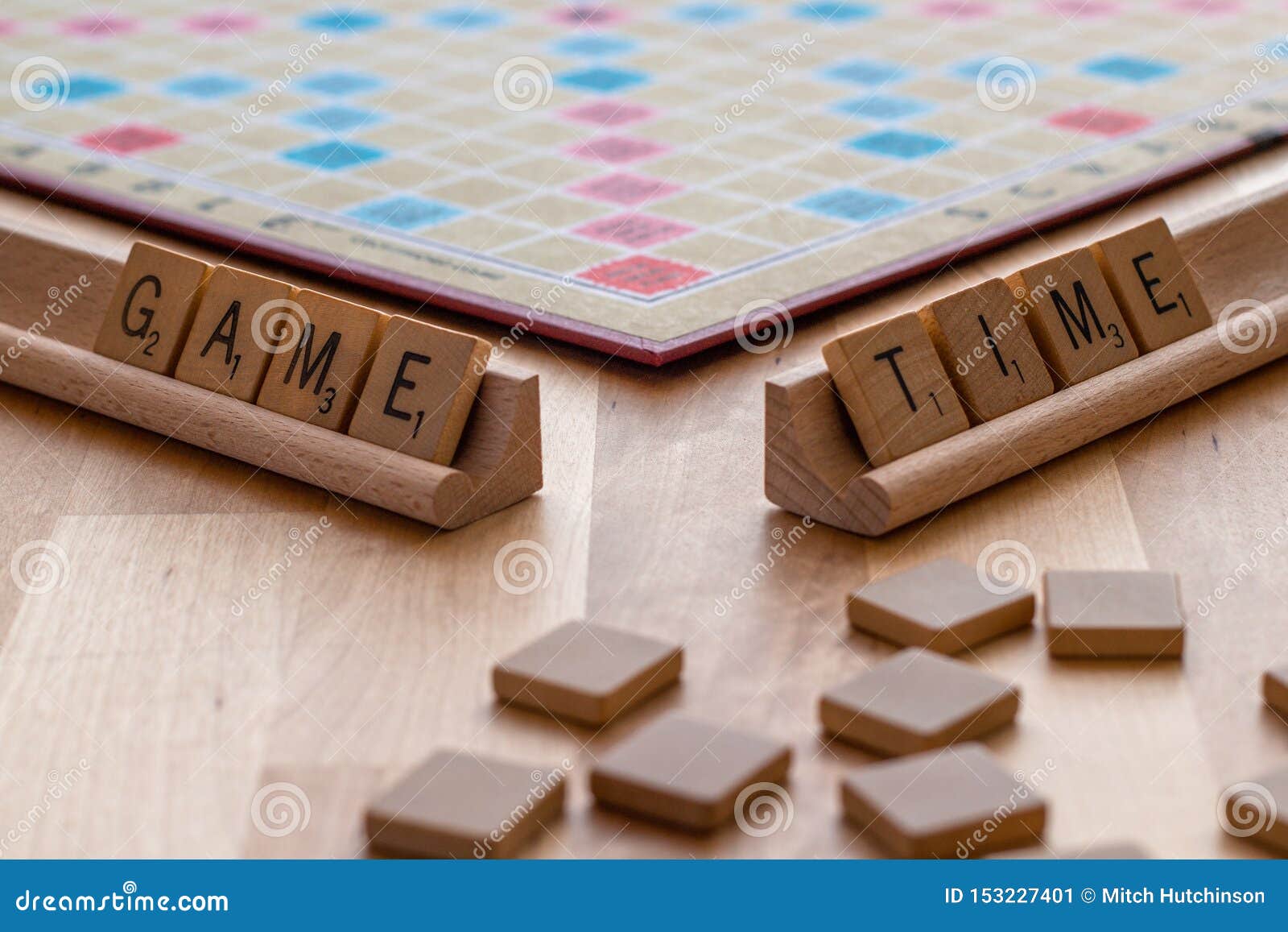 Scrabble Board Game with the Scrabble Tile Spell `Game Time` Editorial ...