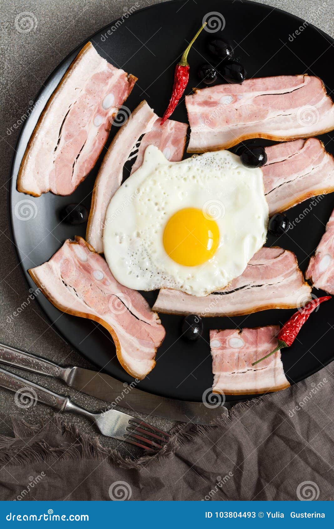 Scrambled Eggs with Bacon on a Black Plate, Top View. an Appetizing ...