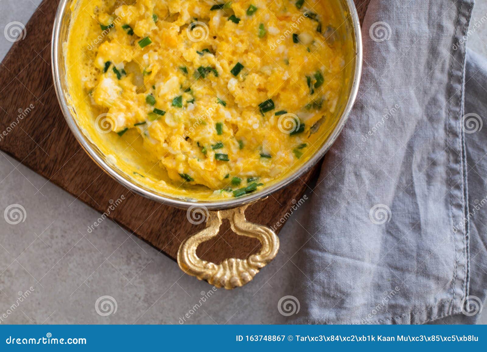 Scrambled Eggs with Cheese and Spring Onion. Served in a Copper Pan ...