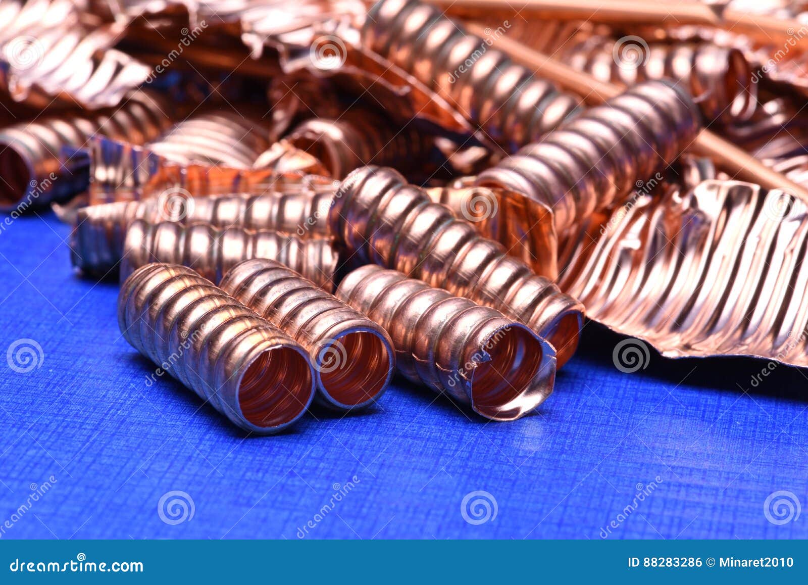 Scrap of Copper for Recycling on Blue Background Stock Photo - Image of ...