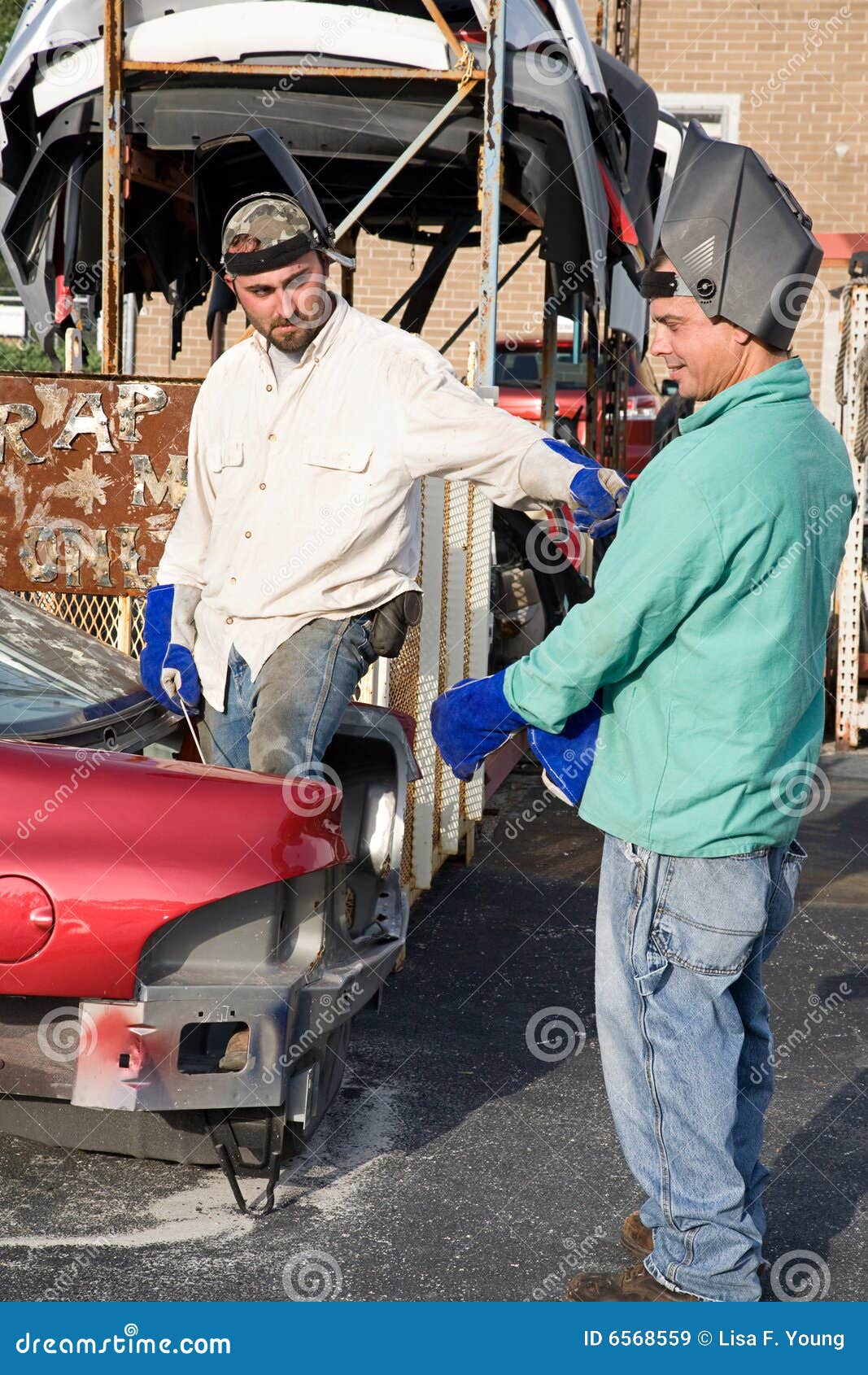 Scrap Metal Workers stock image. Image of helmet, gloves - 6568559