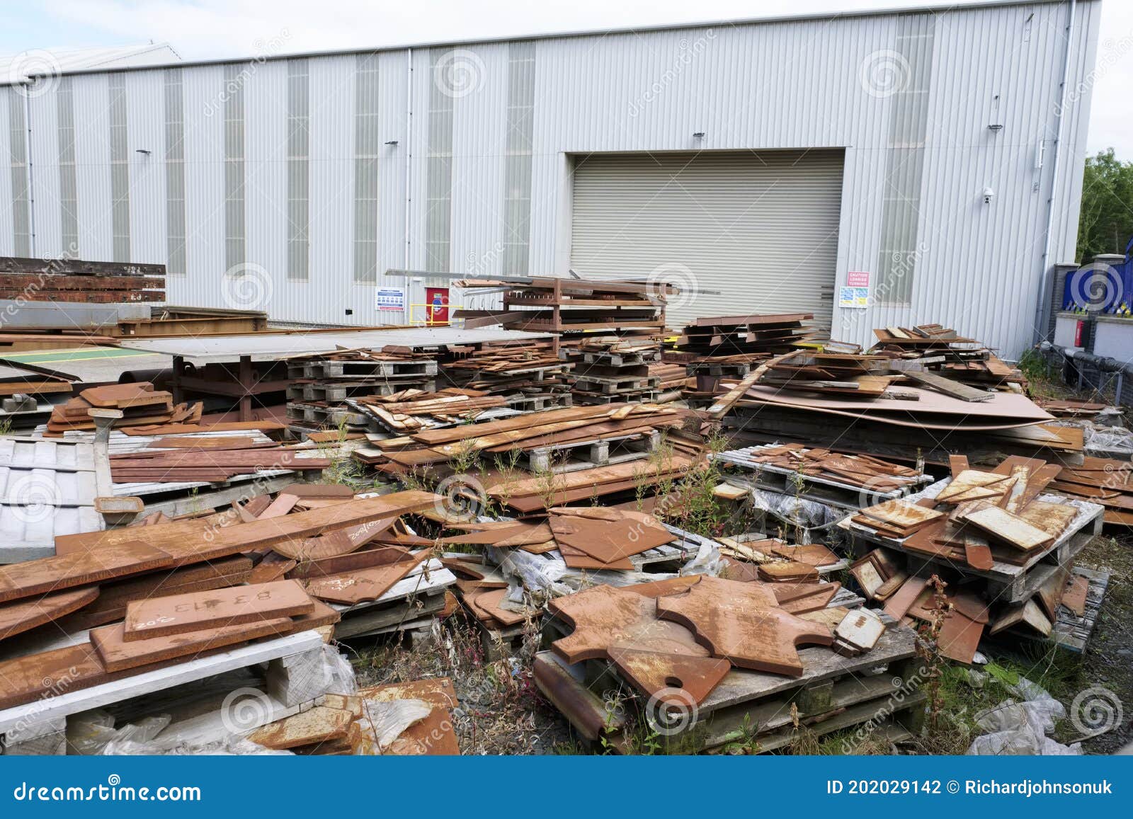 Scrap Metal Yard Stack of Steel and Iron Girders and Plates Stock Photo ...