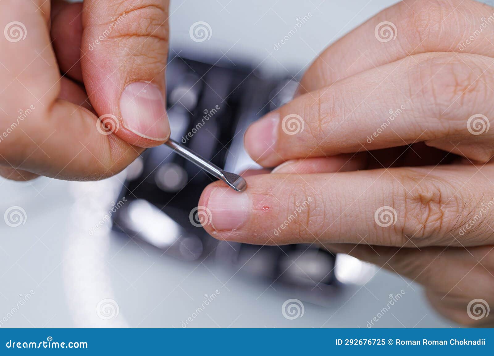 Scraping the Nail with a Tool. a Man Gives Himself a Manicure Stock ...