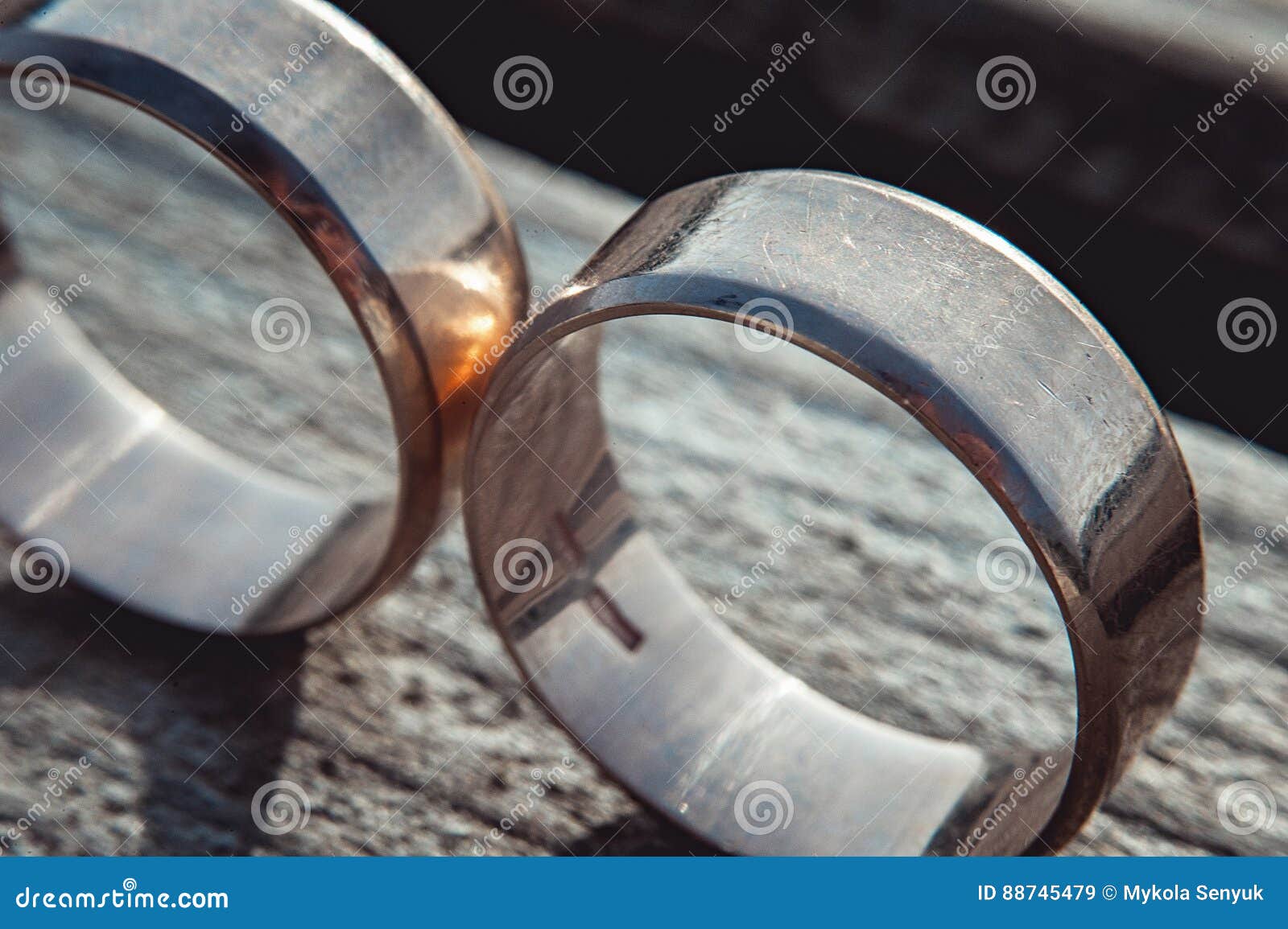 Scratched Two Wide Gold Wedding Rings on Stone Surface Stock Image ...