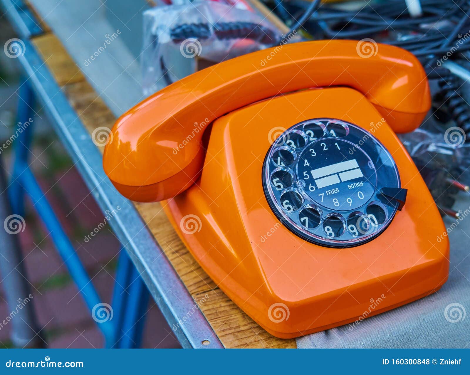 Screeching Orange Colored Old Ugly Analog Mechanical Telephone with ...