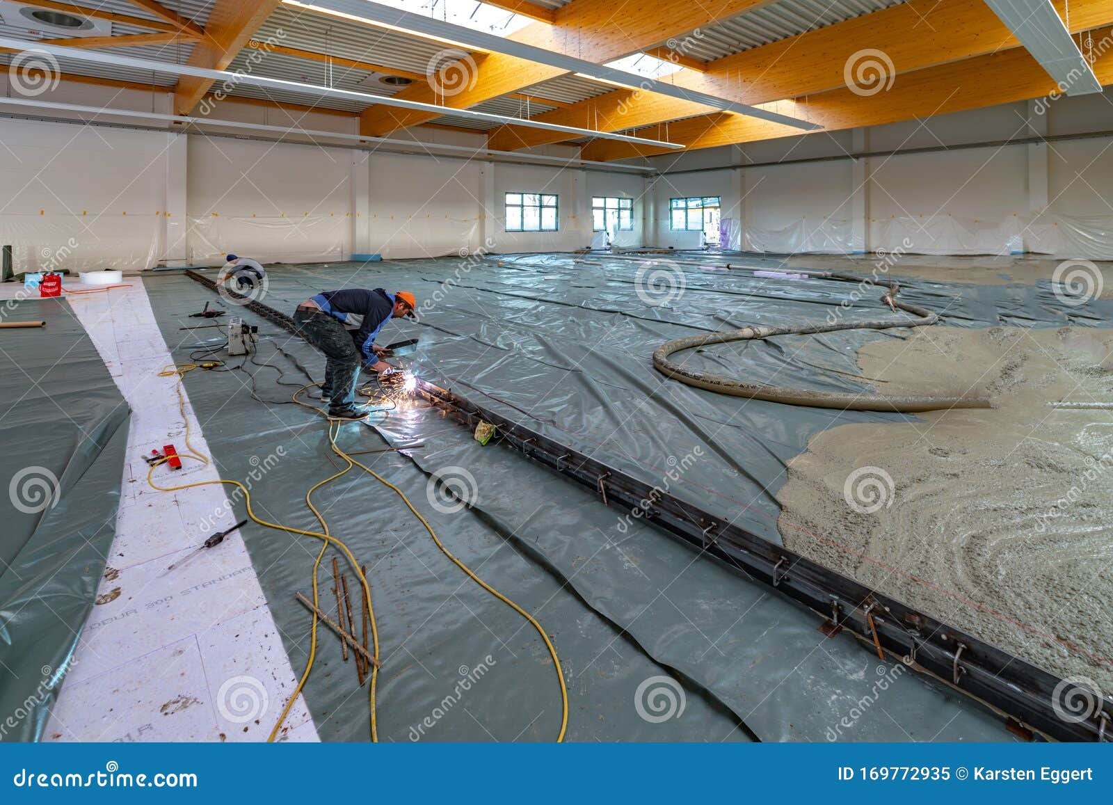 Screed is Poured on a Construction Site Inside a Large Factory Building ...