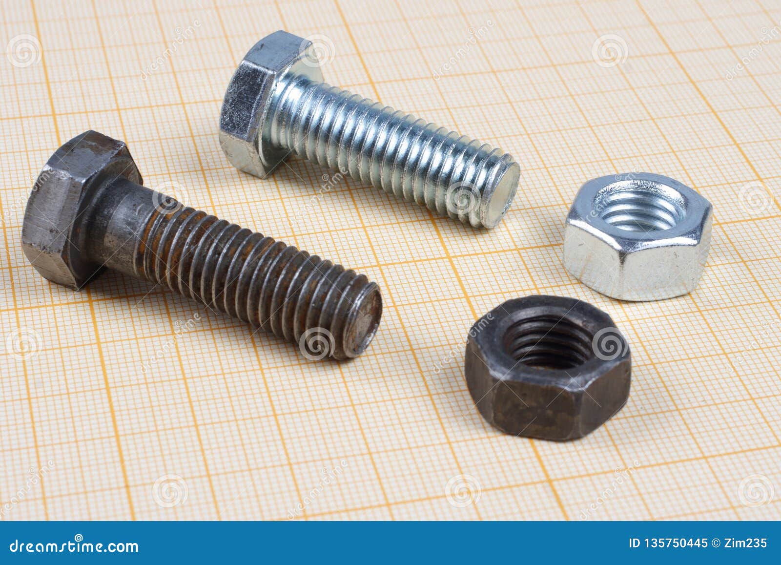 Screw, Nuts on graph paper stock image. Image of industrial - 135750445