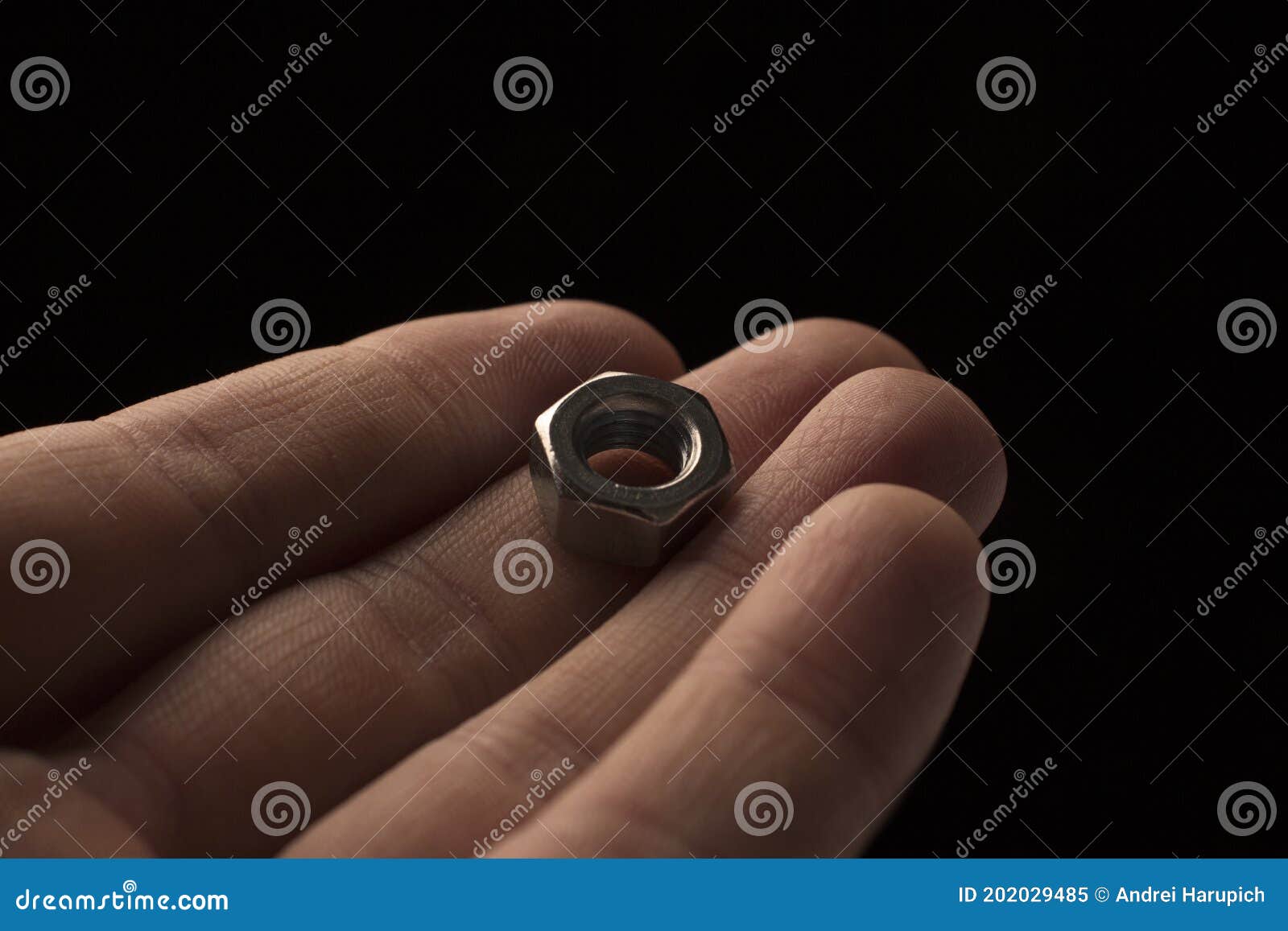 Screw-nuts in hands stock image. Image of industrial - 202029485