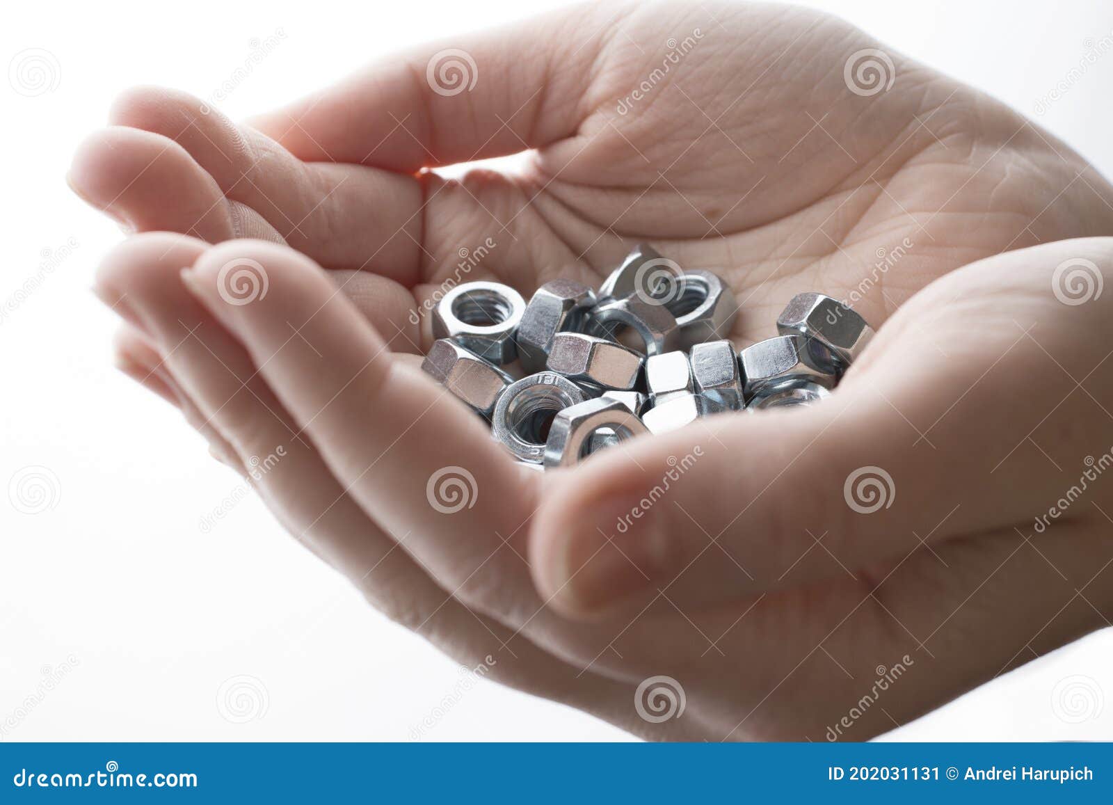 Screw-nuts in hands stock image. Image of fasteners - 202031131