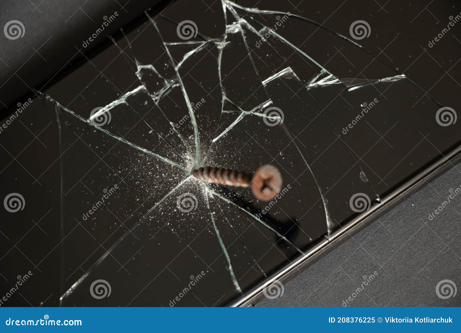 Is Screwed into the Screen of a Touch-sensitive Black Mobile Phone, a ...