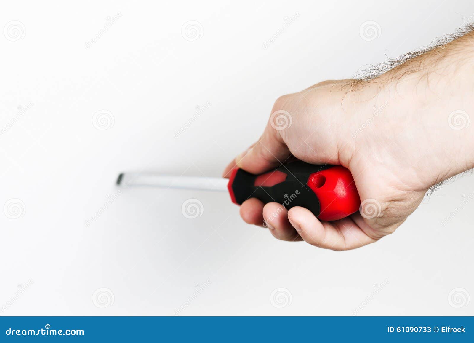 Screwdriver in the hand stock image. Image of occupation - 61090733