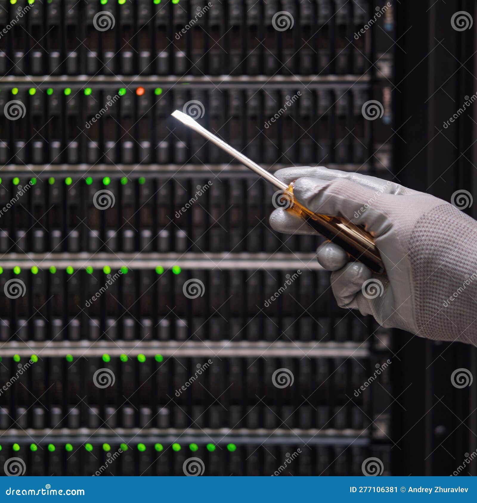 Screwdriver in the Hands of a Man at the Server for Data Storage, Close ...