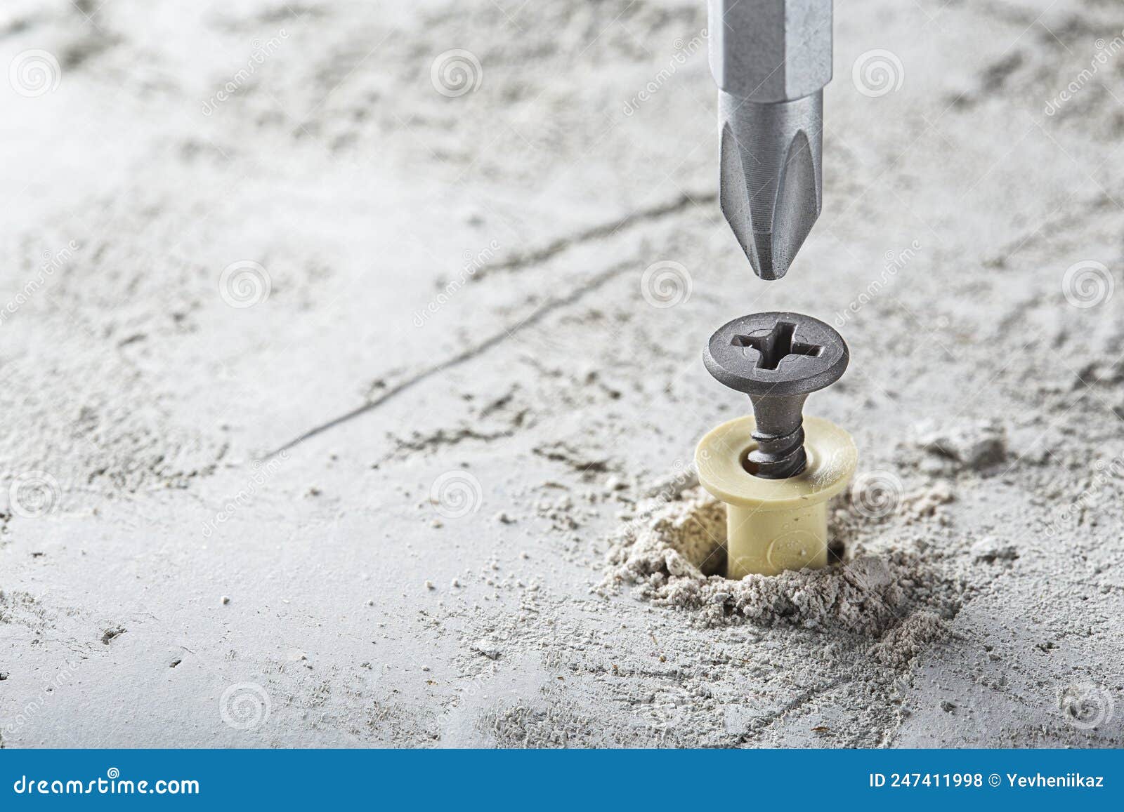 Screwdriver and Dowel in a Concrete Wall Background Stock Photo - Image ...