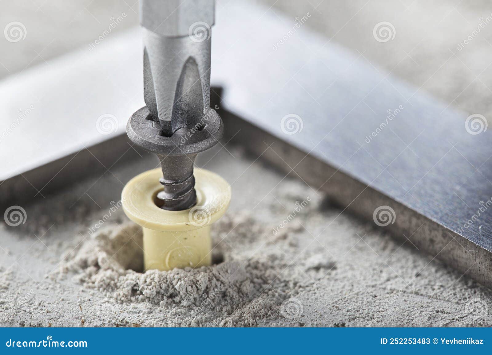 Screwdriver and Dowel in a Concrete Wall Background Stock Image - Image ...