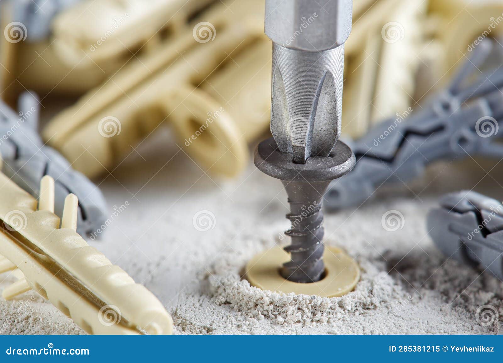 Screwdriver and Dowel in a Concrete Wall Background Stock Image - Image ...