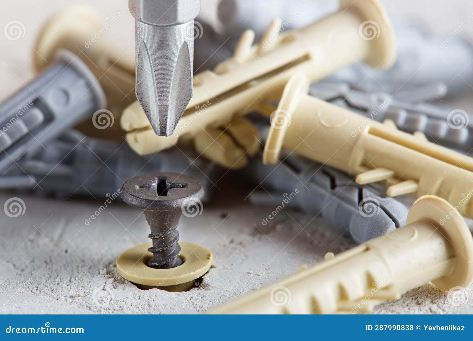 Screwdriver and Dowel in a Concrete Wall Background Stock Photo - Image ...
