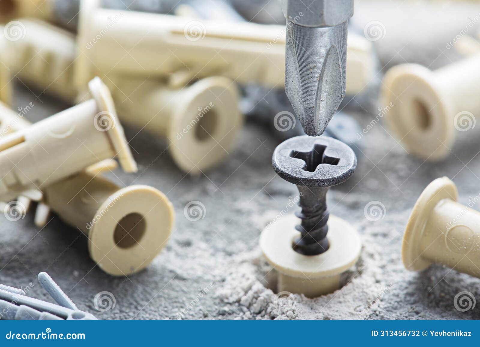 Screwdriver and Dowel in a Concrete Wall Background Stock Photo - Image ...