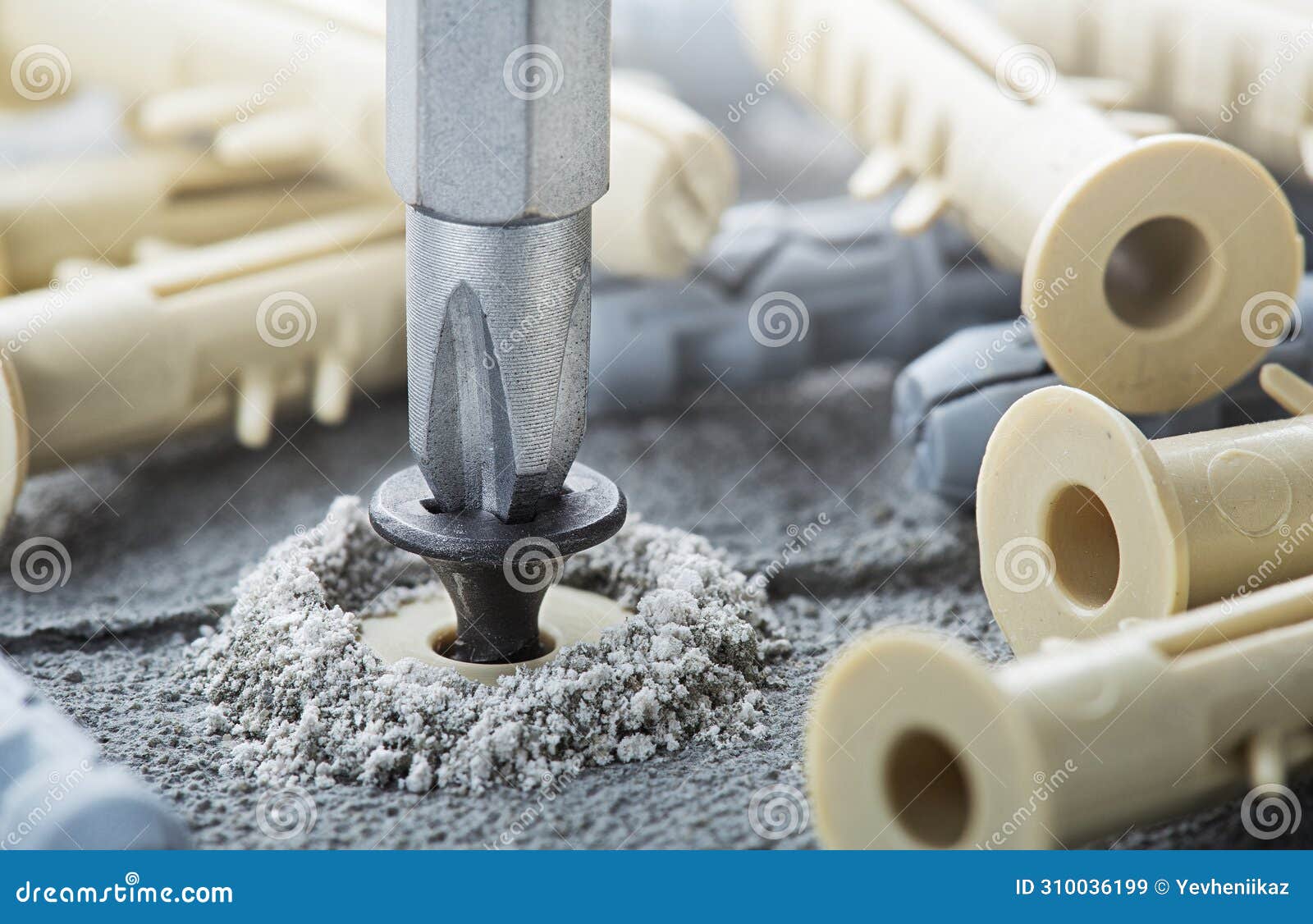 Screwdriver and Dowel in a Concrete Wall Background Stock Image - Image ...