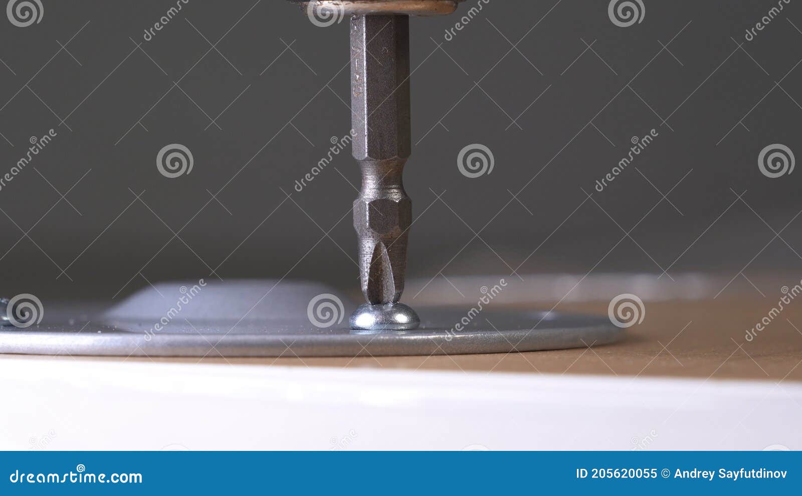 Screwdriver Screwing the Screws into the Table Leg Support. Stock Image ...