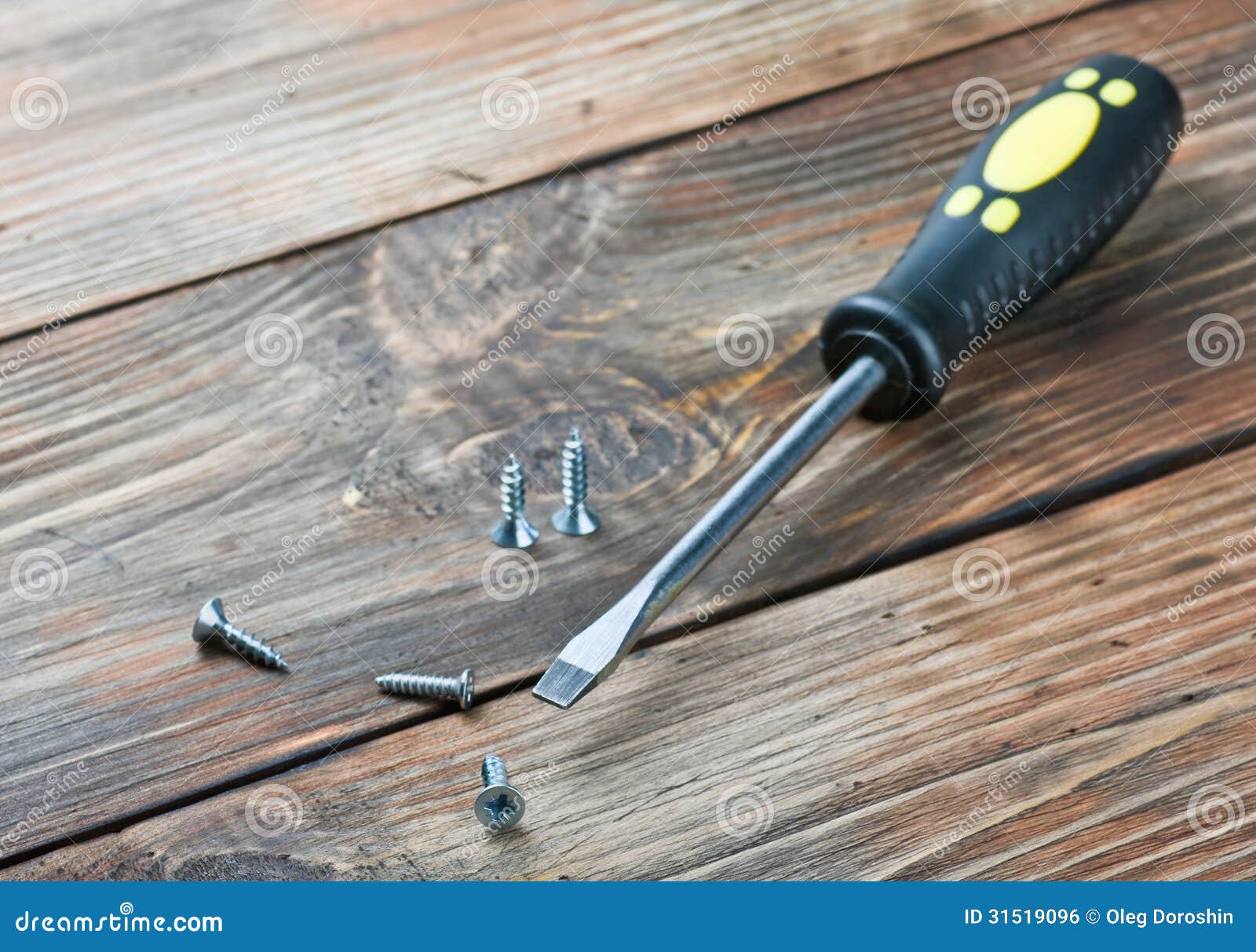 Screwdriver and Screws on a Wooden Stock Photo - Image of screwdriver ...