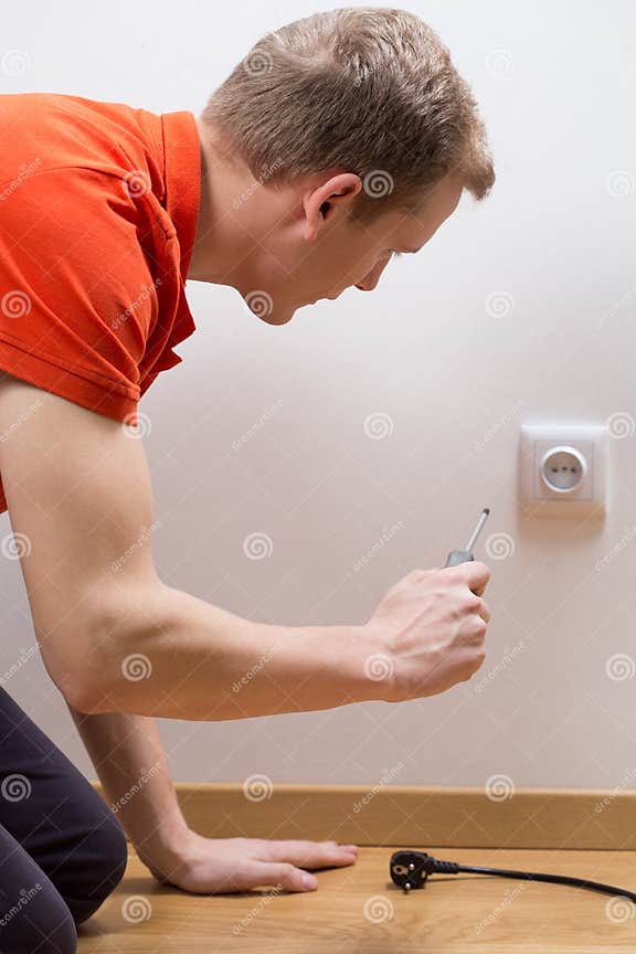 Screwdriver in socket stock photo. Image of electricity - 52992444