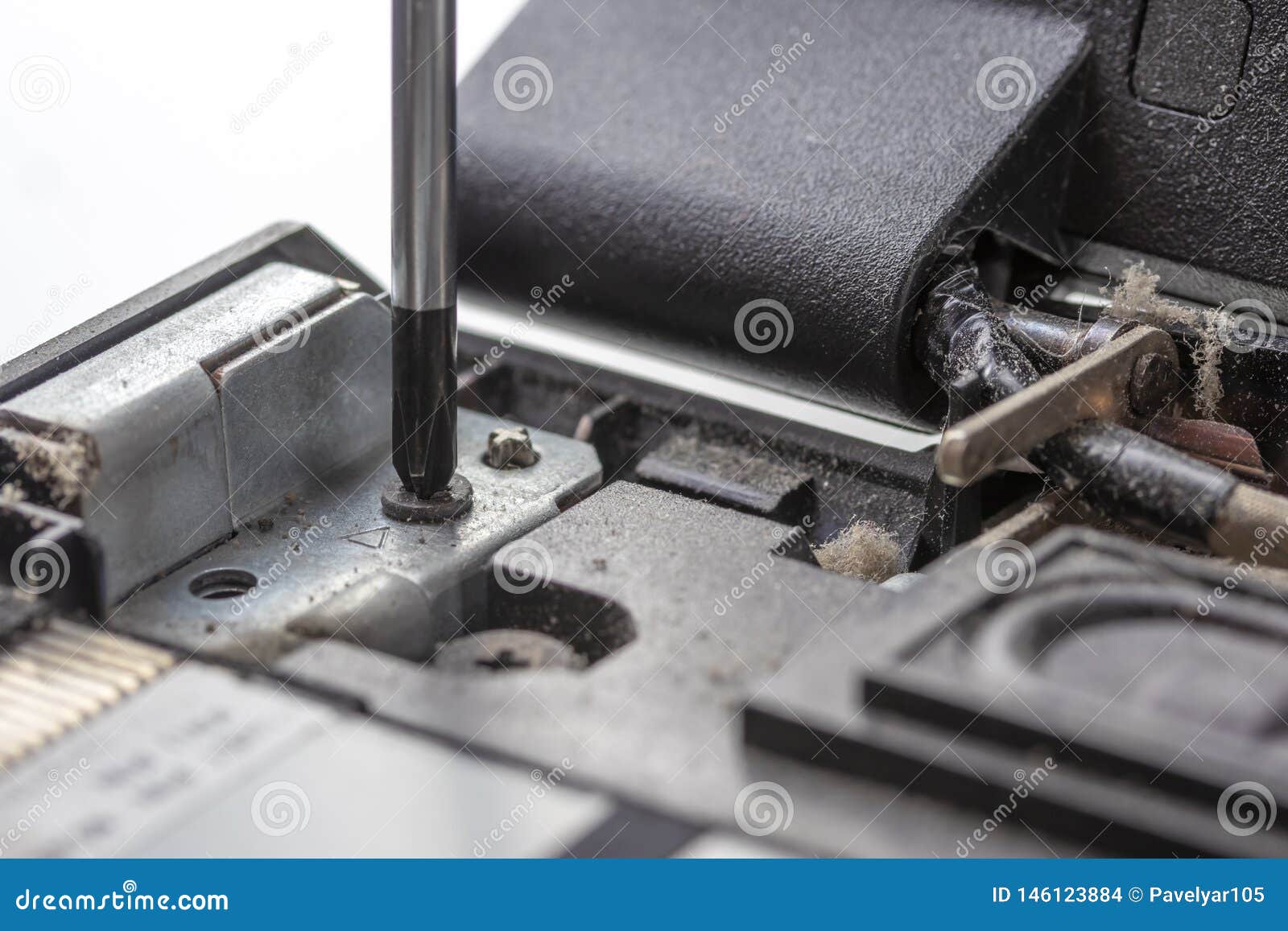 The Screwdriver Unscrews the Fastening Bolt of the Processor Computer ...