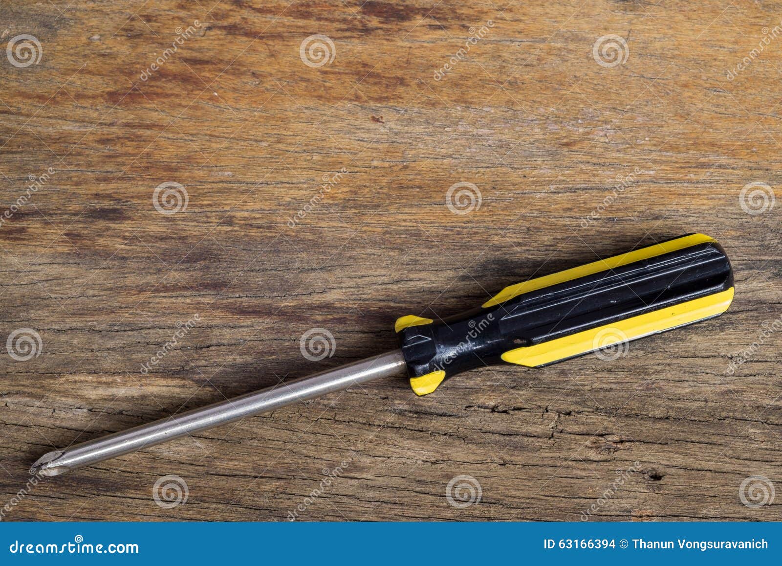 Screwdriver on wood table stock photo. Image of hardware - 63166394
