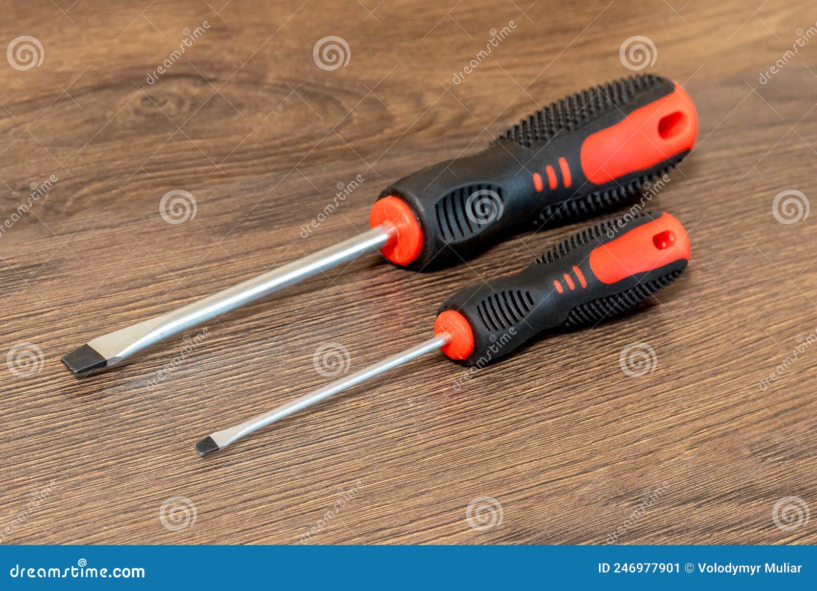 Screwdrivers of Different Sizes with Straight Tips on a Wooden Table ...