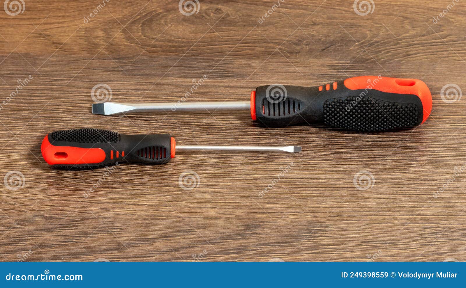 Screwdrivers of Different Sizes with Straight Tips on a Wooden Table ...
