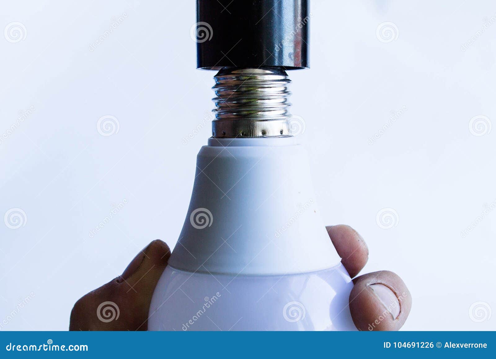 Screwing the Light Bulb into the Socket Stock Photo - Image of recovery ...