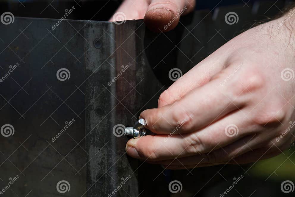 Screwing Up a Nut by Hand. Close Up. Stock Photo - Image of connection ...