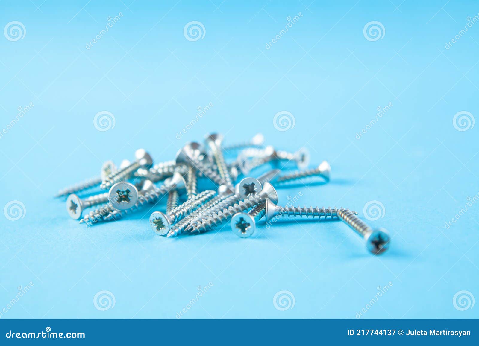 Screws on a Blue Background Stock Image - Image of metal, construction ...