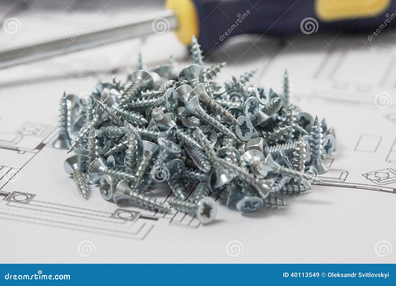Screws lying on blueprint stock image. Image of paper - 40113549